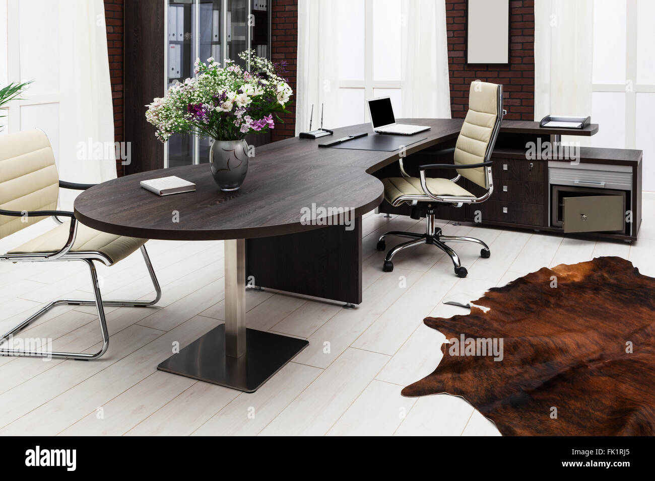 bouquet of flowers on a desk at modern office Stock Photo - Alamy