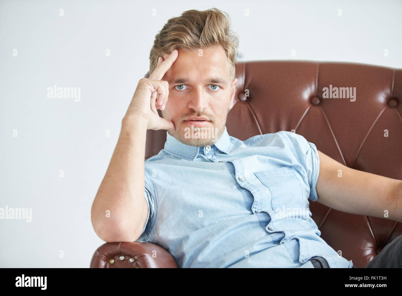 Portrait of a stylish intelligent man, small unshaven, charismatic ...