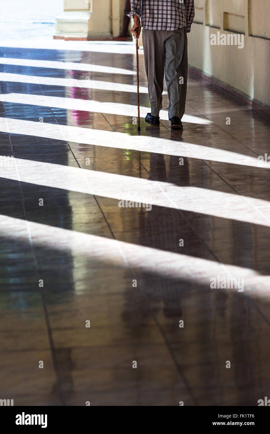 an old man with a cane on the sidewalk Stock Photo - Alamy