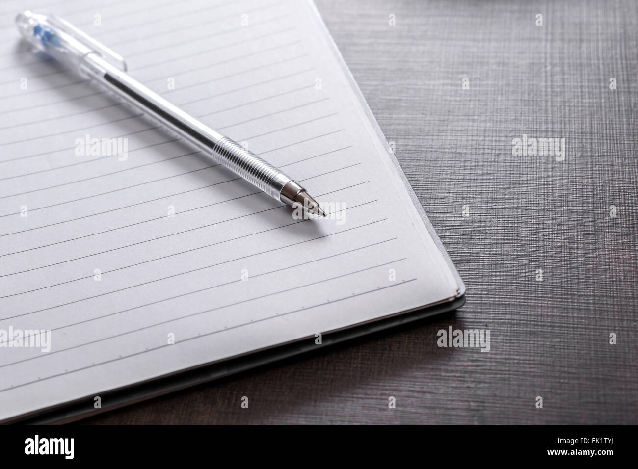 Open notebook on the desk, close up Stock Photo - Alamy