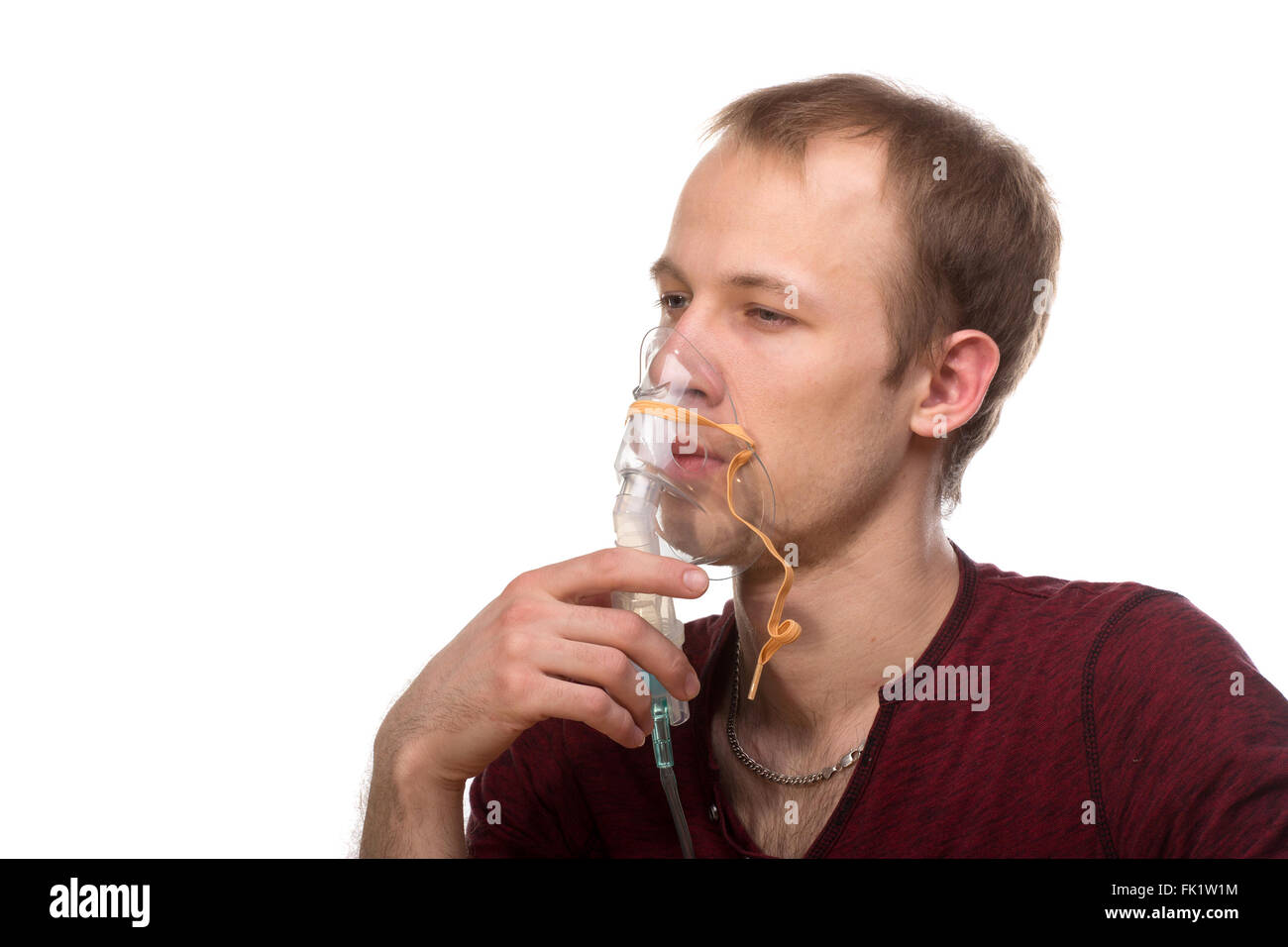 Young man using nebulizer mask for respiratory inhaler Asthma Treatment ...