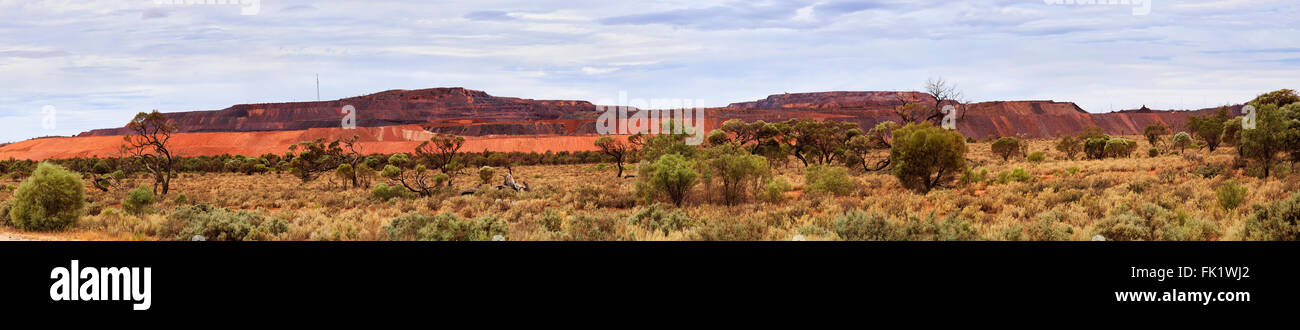 wide horizontal panorama of open pit iron ore mine in South Australia ...