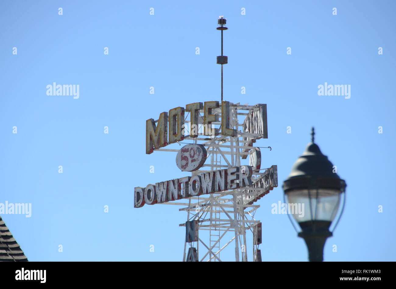 motel downtowner sign flagstaff with street light blue sky Stock Photo ...