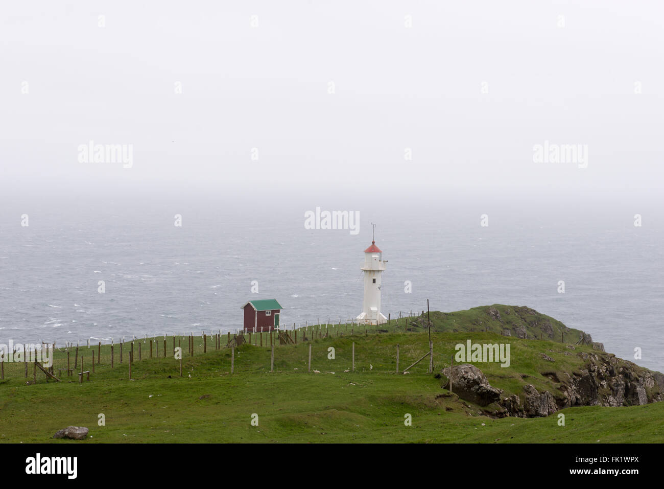 Landscape on the Faroe Islands with lighthouse at Akraberg on the ...