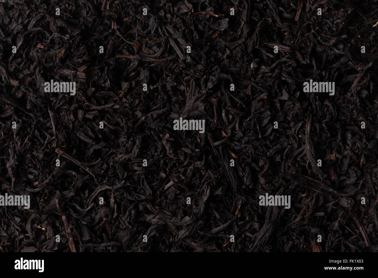 dry black tea leaves close up of texture for background Stock Photo - Alamy