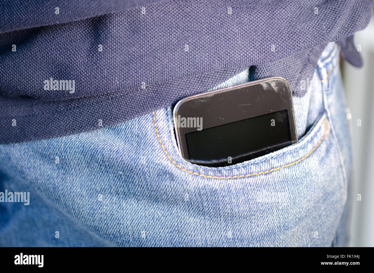 Phone in pocket Stock Photo - Alamy