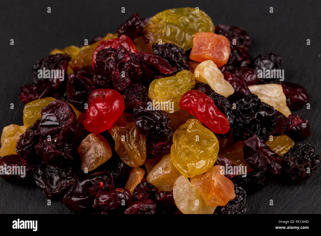 Mix variety of dried fruiton black dark stone background Stock Photo ...