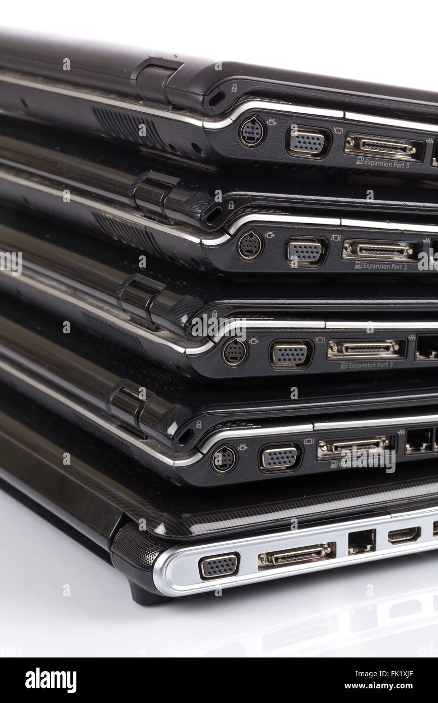 stack of old laptops awaiting repair isolated on white background Stock ...