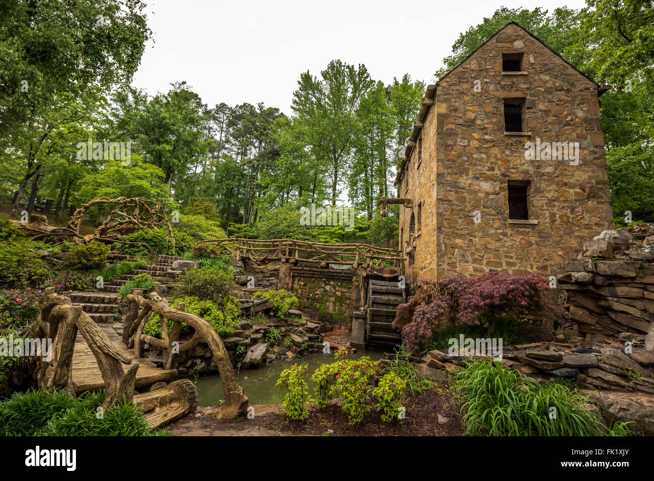 Stone grist mill with spring foliage Stock Photo - Alamy