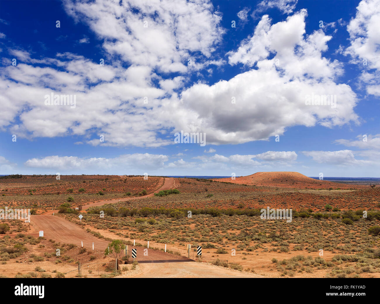 flat red soil outback plain near Flinders Ranges national park with ...