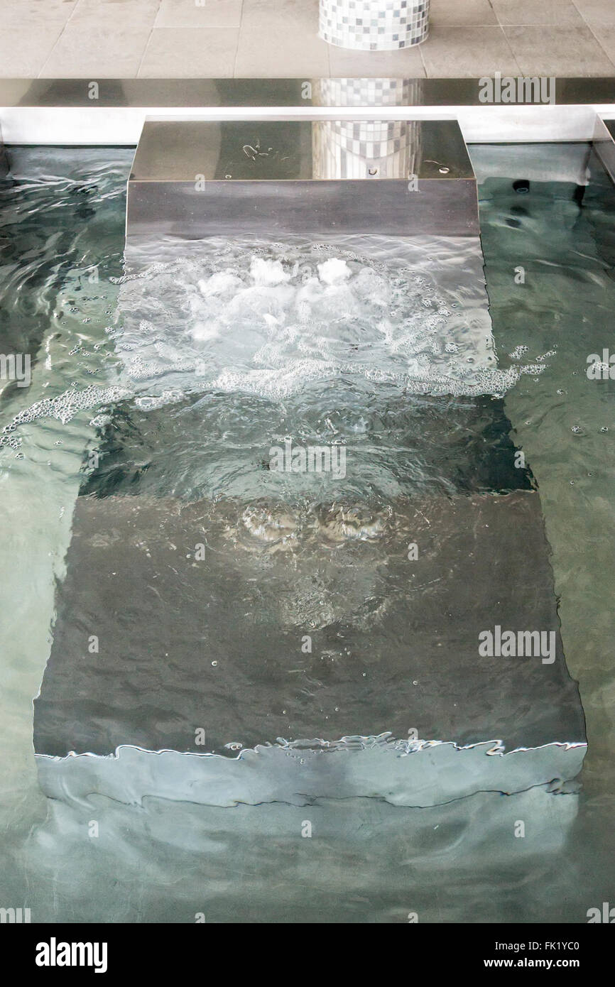 Empty interior swimming pool with relaxation area in a modern hotel ...