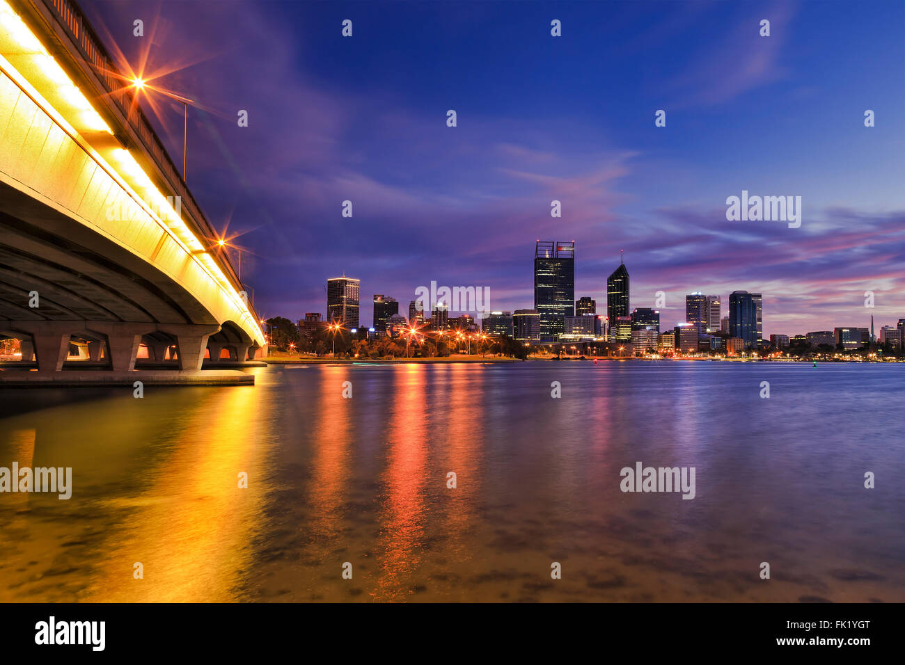colourful sunrise over Perth city CBD with connecting bridge across ...