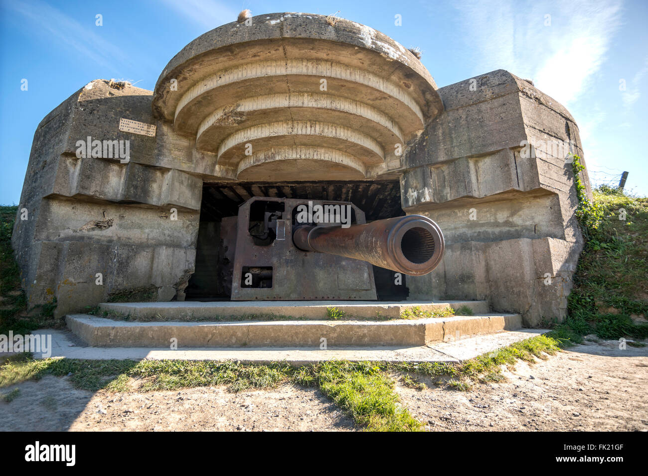 The bunker with cannon in Normandy Stock Photo - Alamy