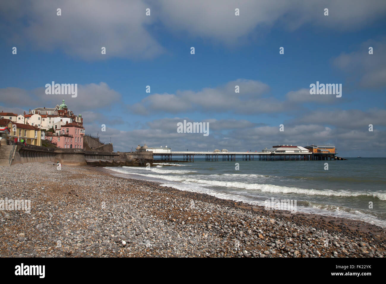 Cromer beach and pier and the colourful Victorian buildings against the ...