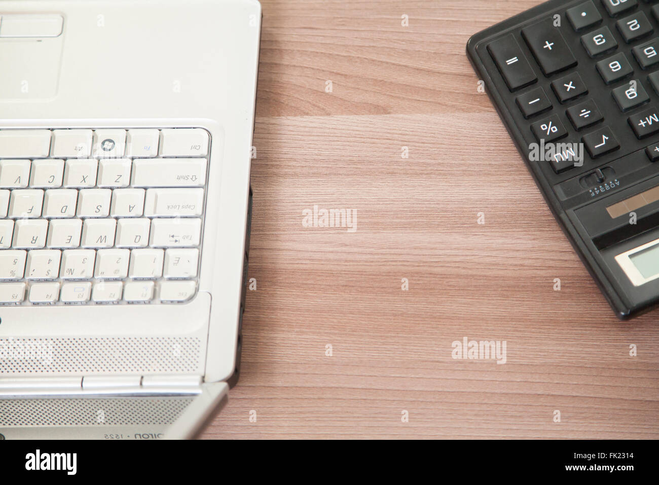 Calculator and laptop on the table Stock Photo - Alamy