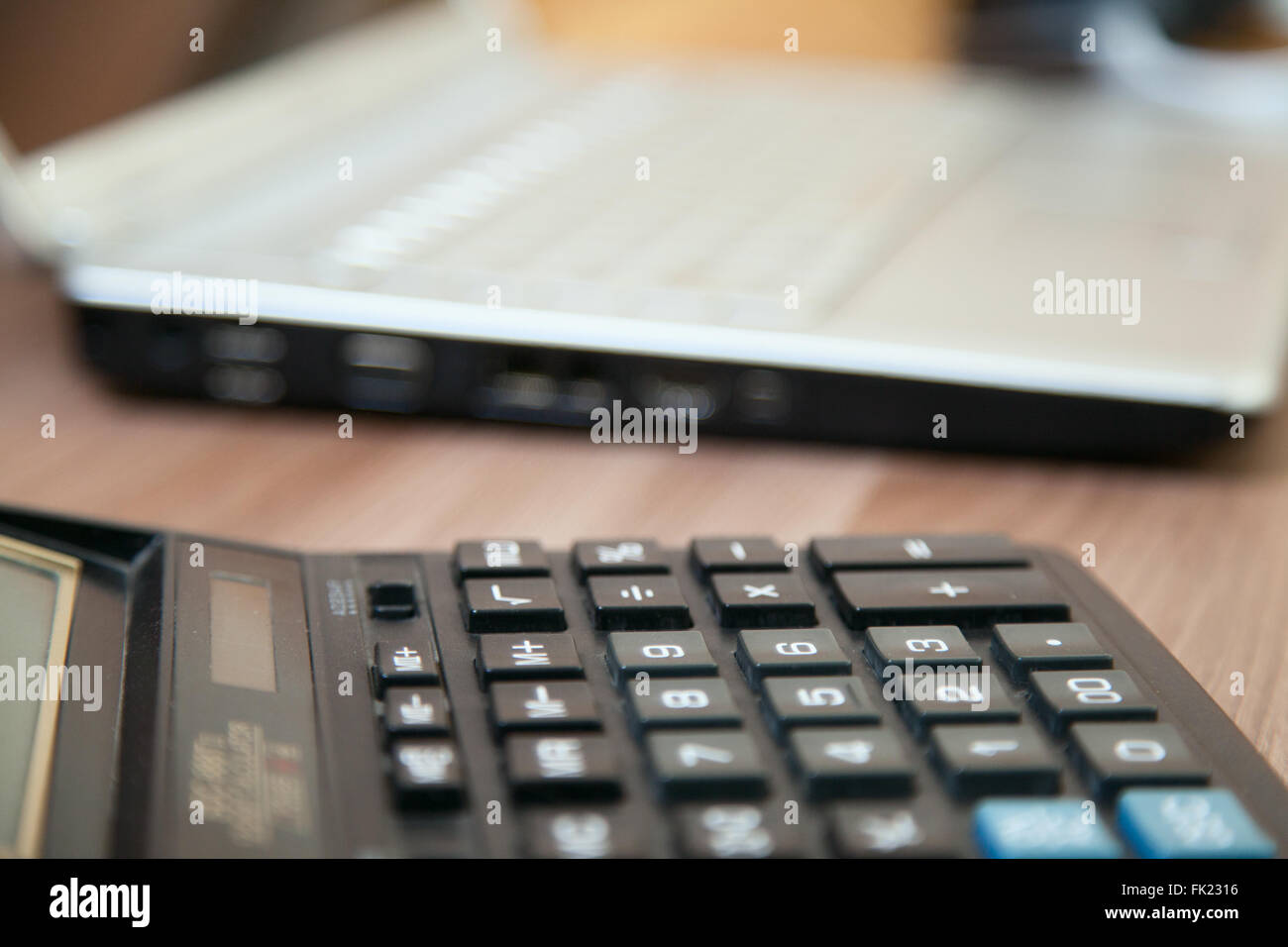 Hand using calculator class hi-res stock photography and images - Alamy