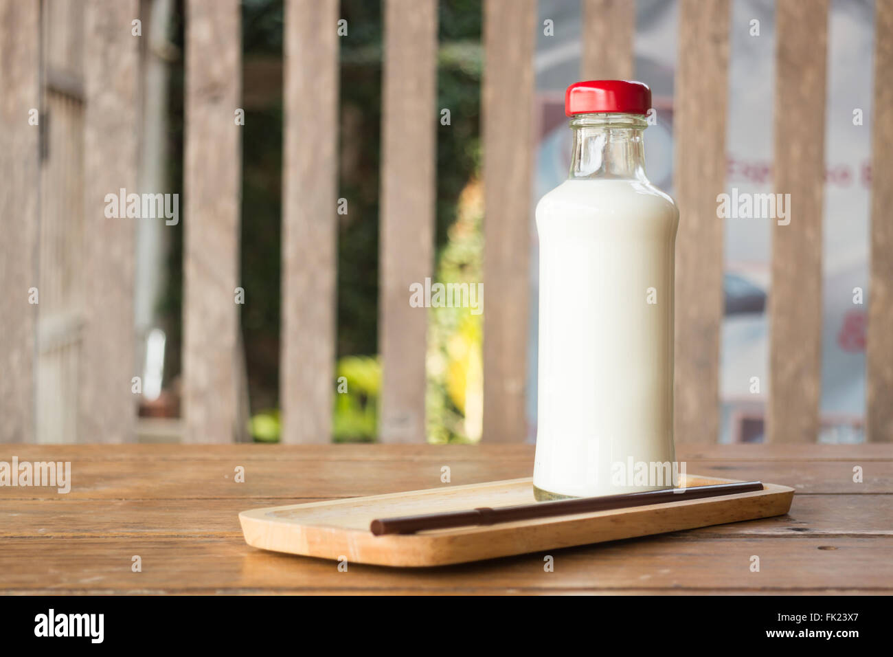 Bottle of milk on wooden table, stock photo Stock Photo - Alamy