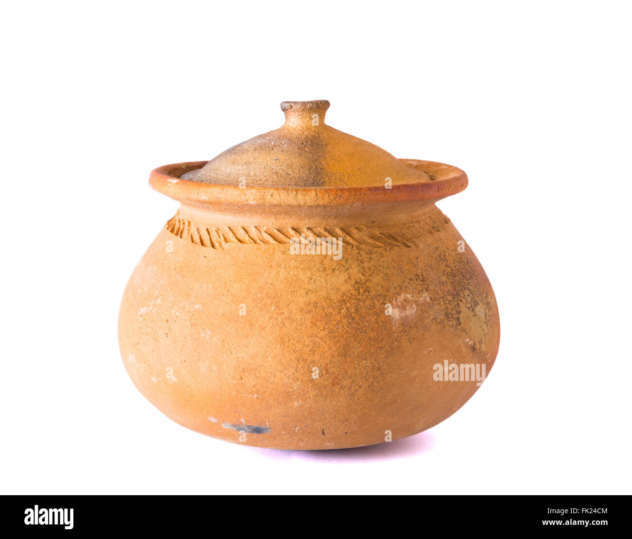 Pots made of traditional clay for use in the kitchen. On a white ...