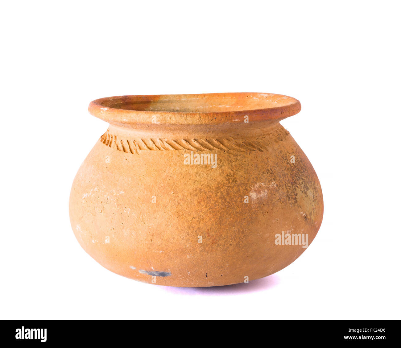 Pots made of traditional clay for use in the kitchen. On a white ...