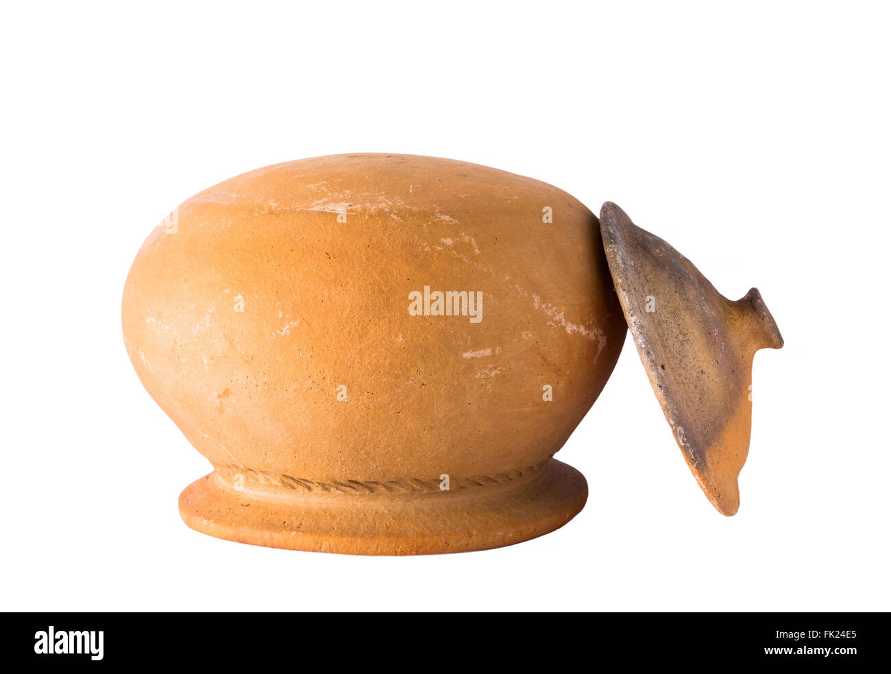 Pots made of traditional clay for use in the kitchen. On a white ...
