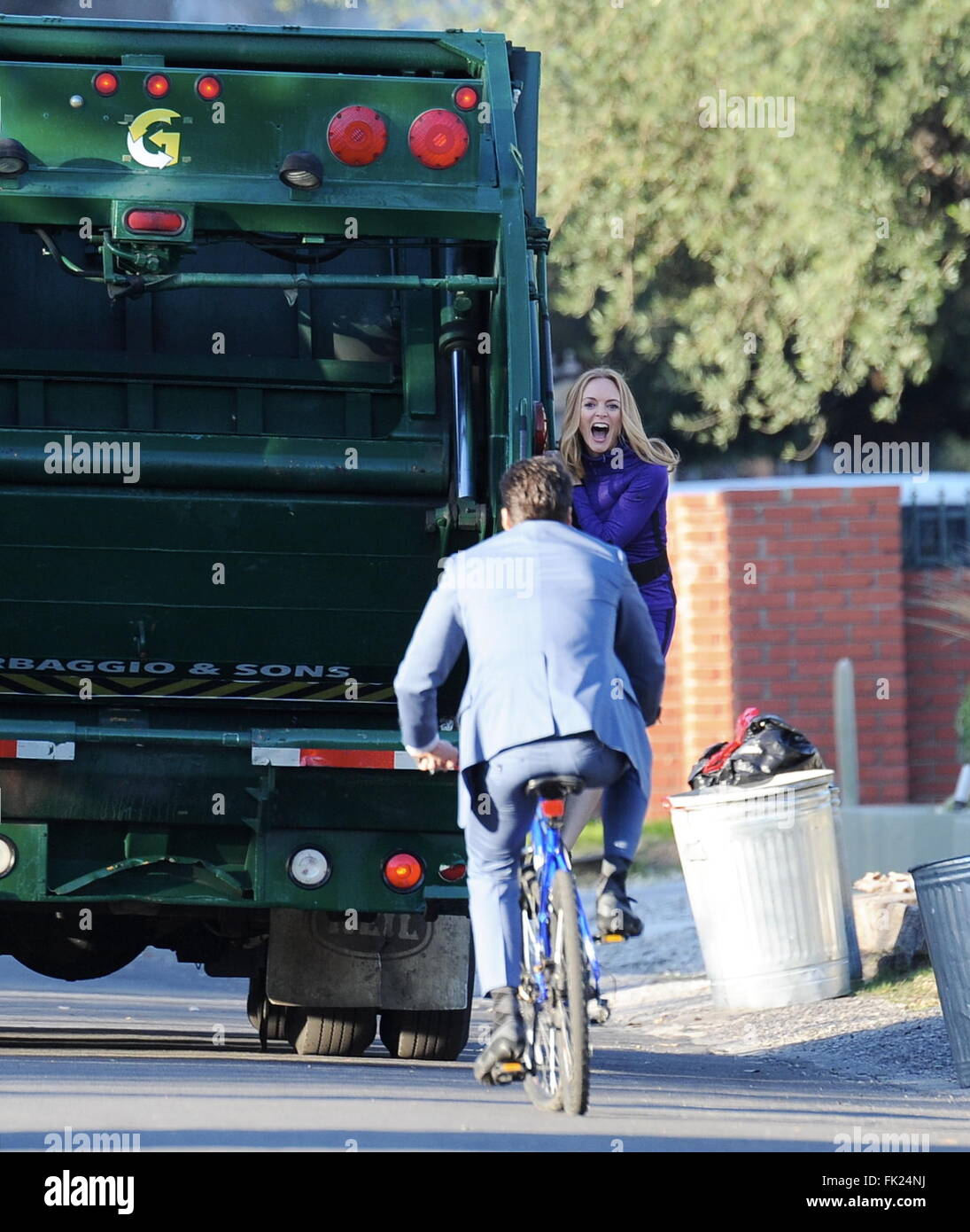 Heather Graham catches a ride on a garbage truck while being chased for ...