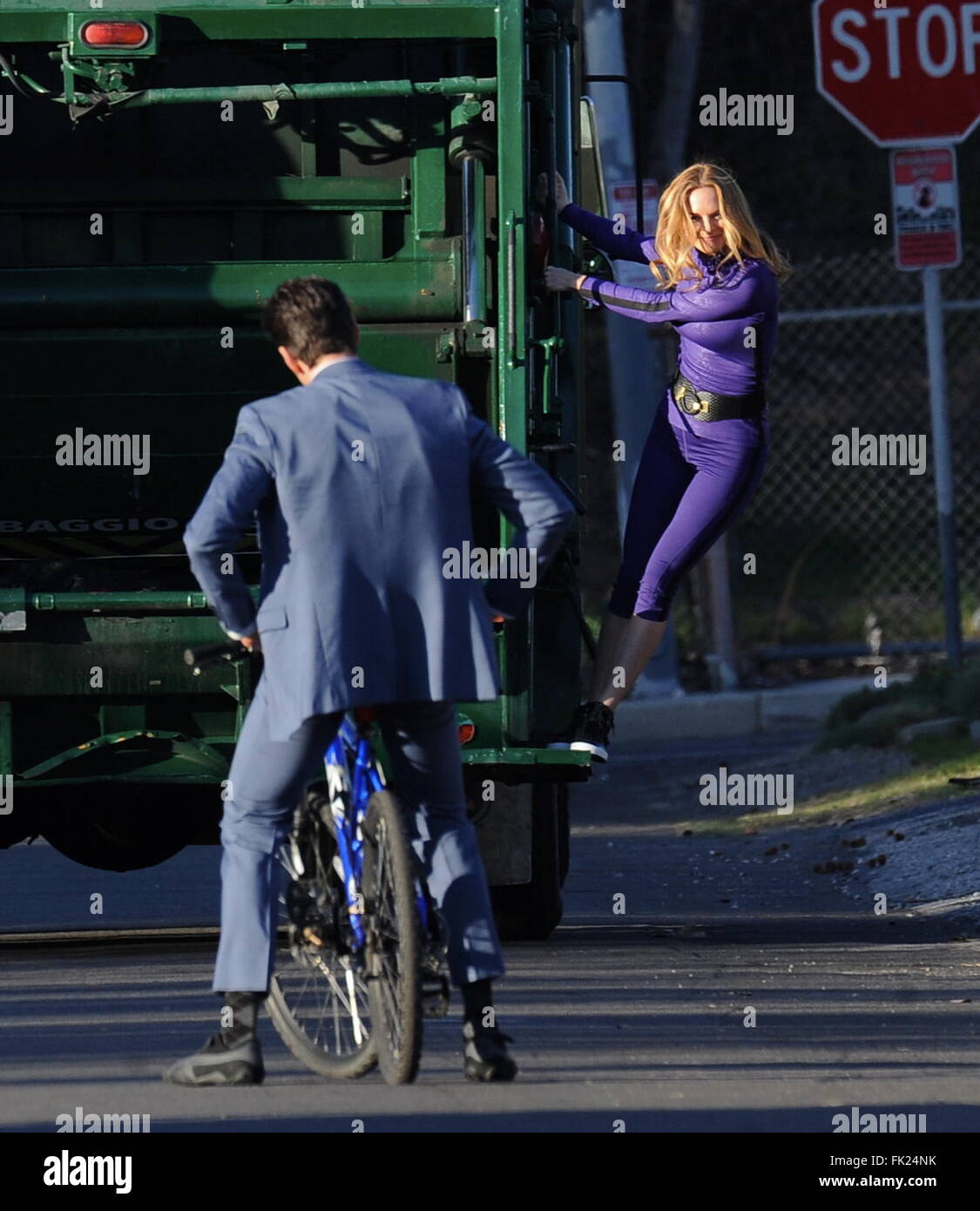 Heather Graham catches a ride on a garbage truck while being chased for ...