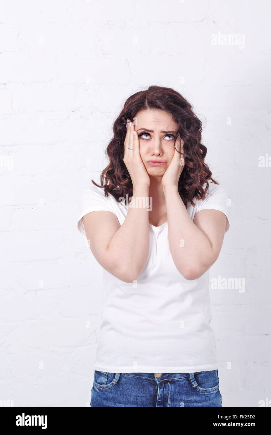 Young cute girl surprised and disappointed. Human emotions Stock Photo ...