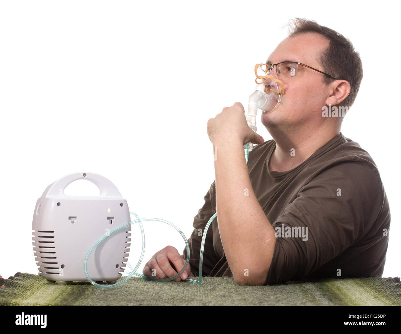 Young man using nebulizer mask for respiratory inhaler Asthma Treatment ...