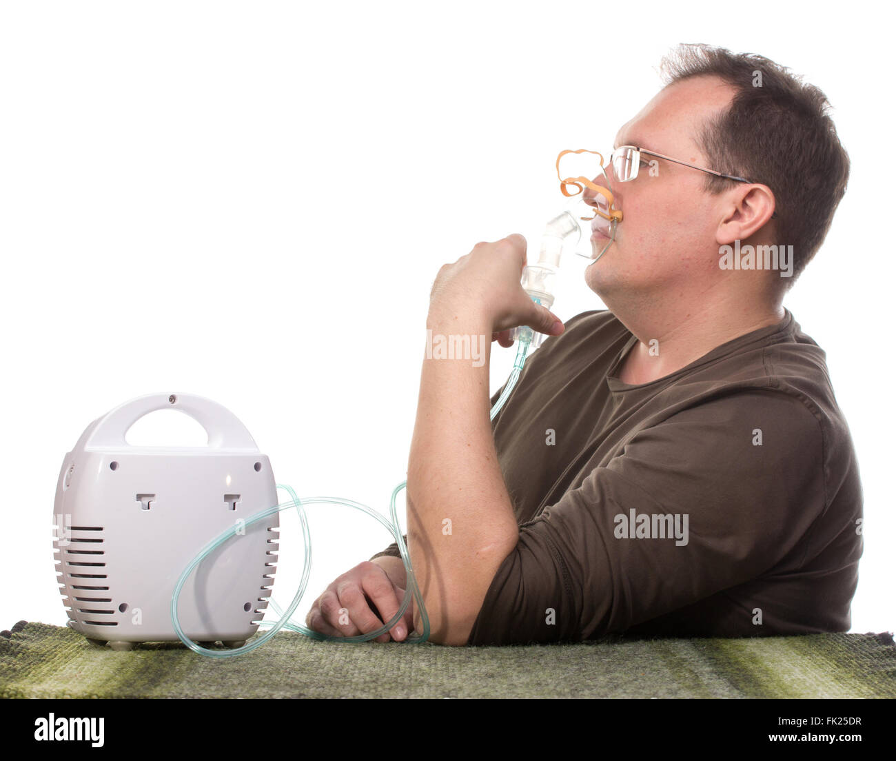 Young man using nebulizer mask for respiratory inhaler Asthma Treatment ...