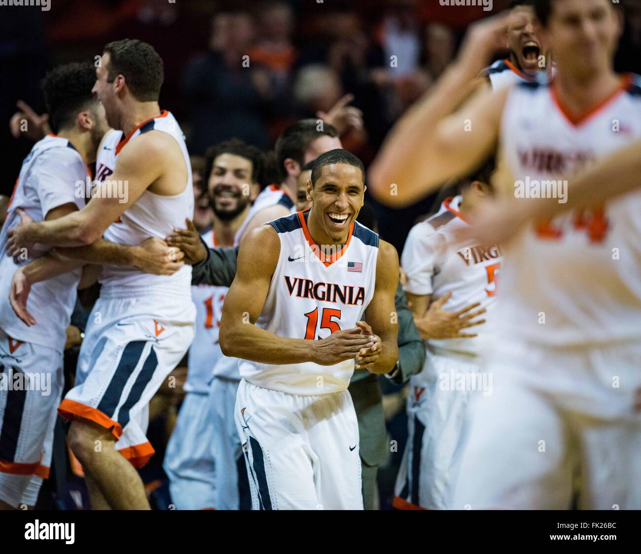 The UVA bench celebrates after Virginia forward Caid Kirven (24) hits a ...