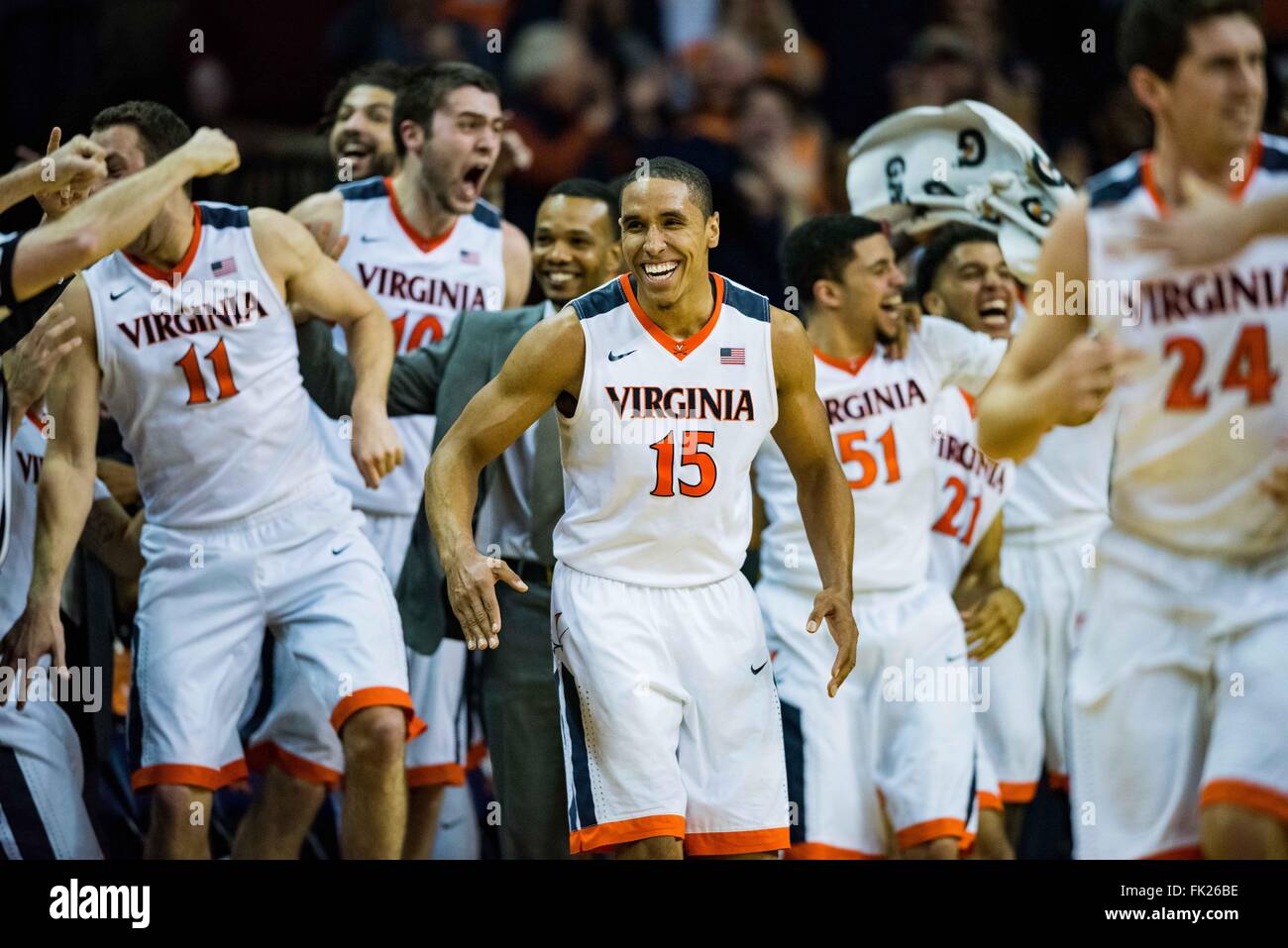 The UVA bench celebrates after Virginia forward Caid Kirven (24) hits a ...