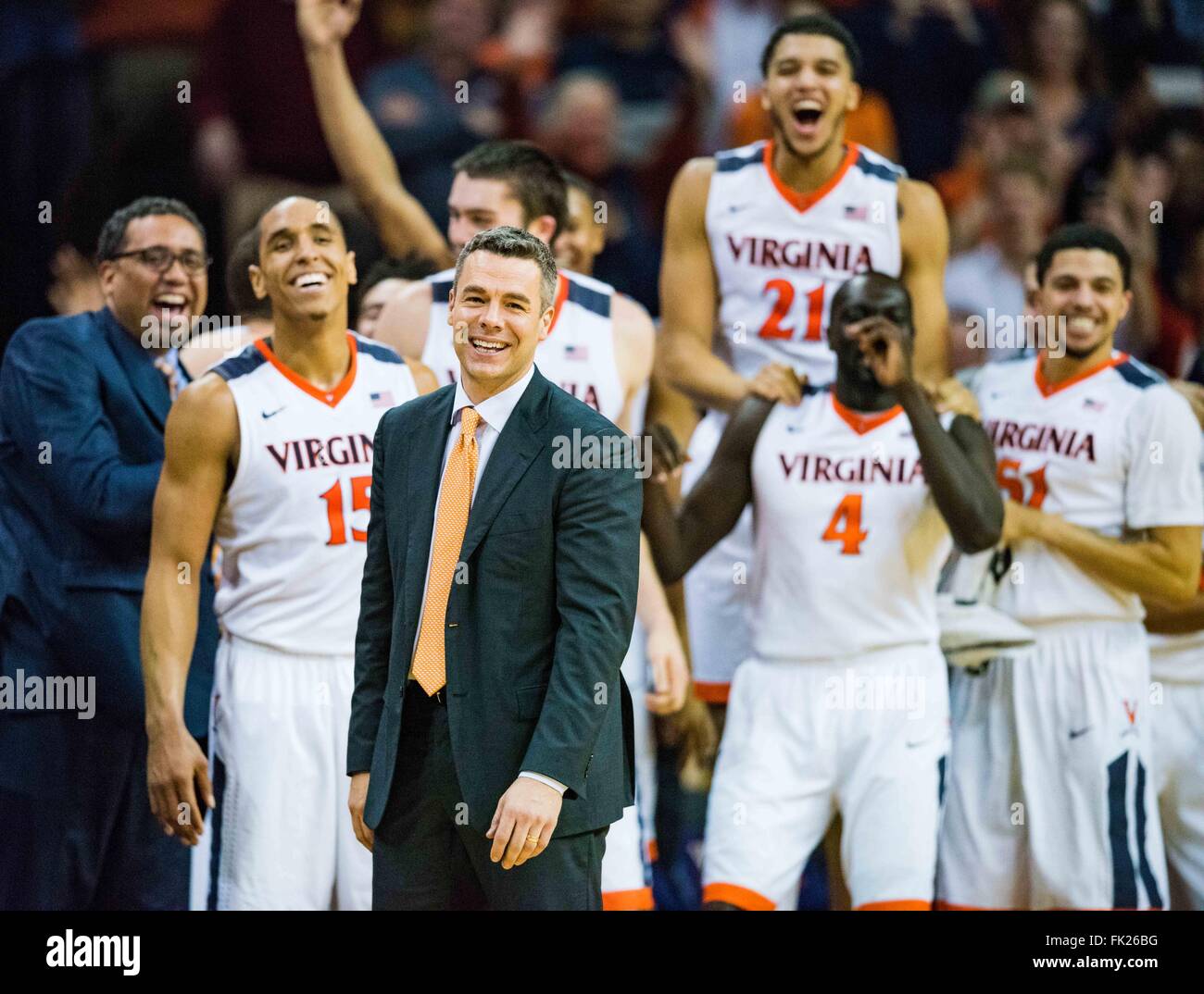 The UVA bench celebrates after Virginia forward Caid Kirven (24) hits a ...