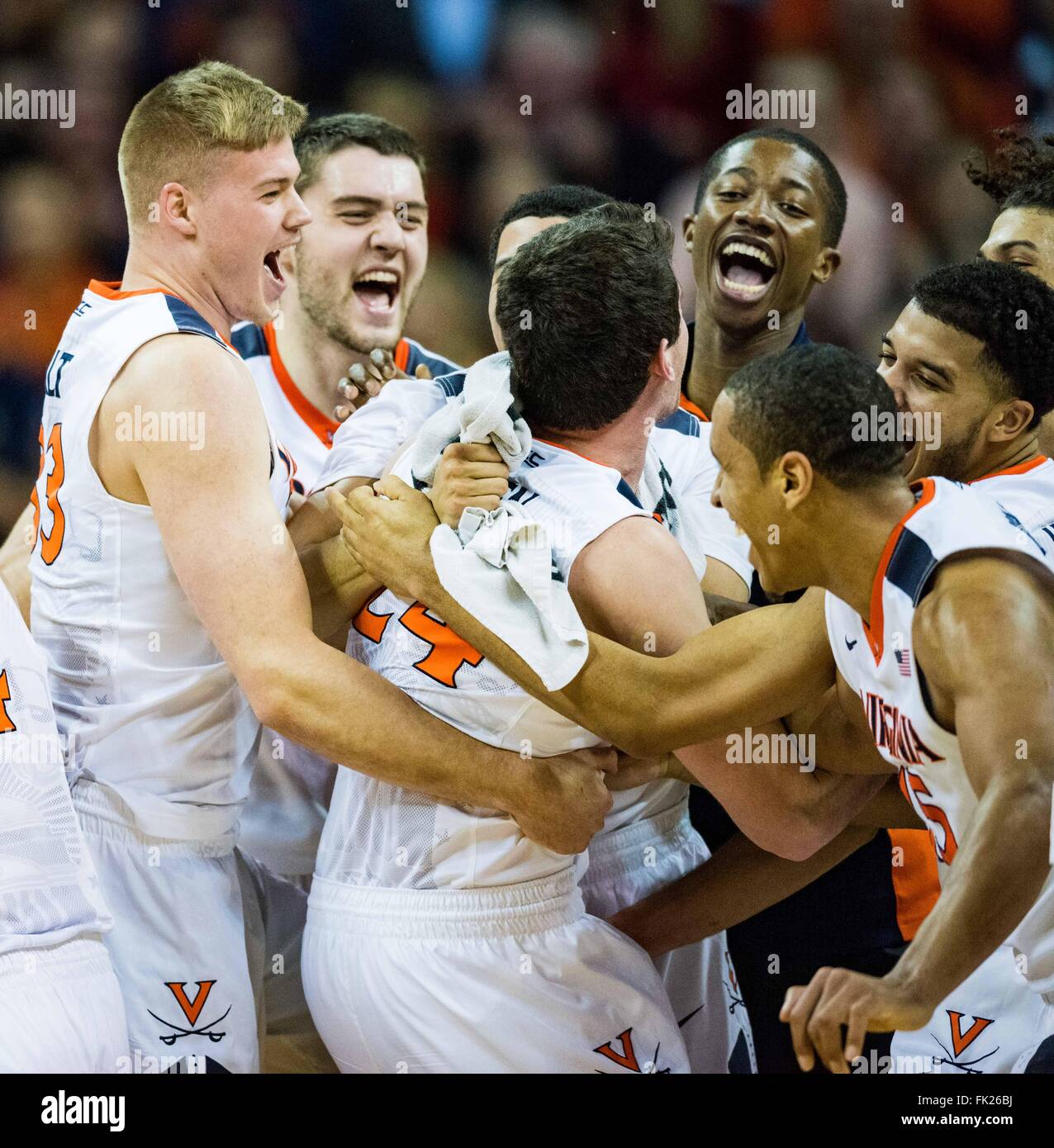 The UVA team celebrates after Virginia forward Caid Kirven (24) hits a ...