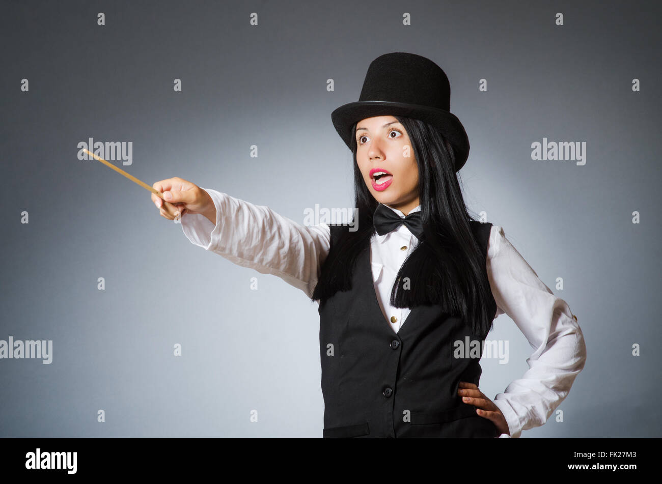 Woman magician in funny concept Stock Photo - Alamy