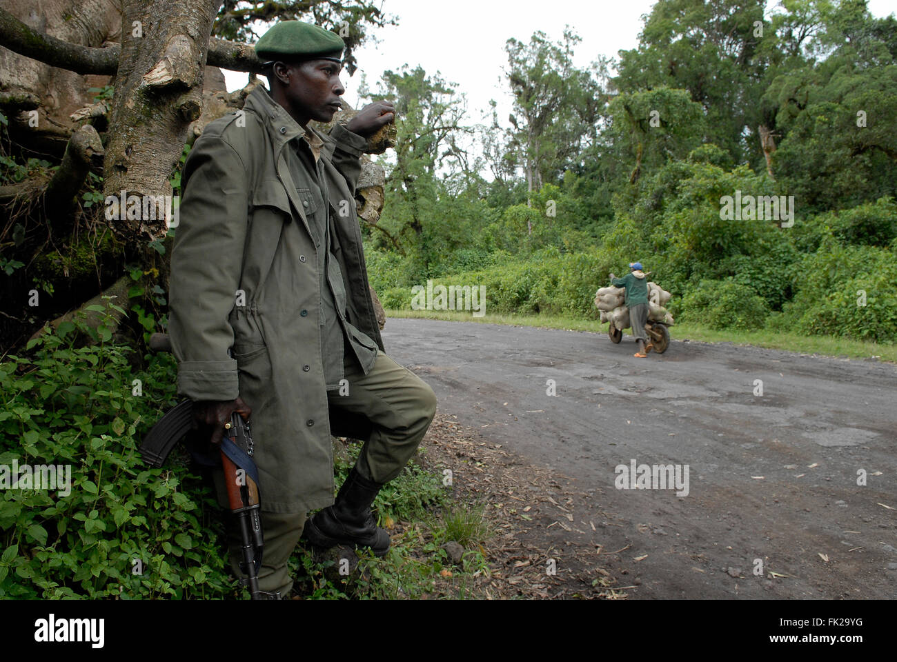 A FARDC Congolese government soldier stands guard with a Kalashnikov AK ...