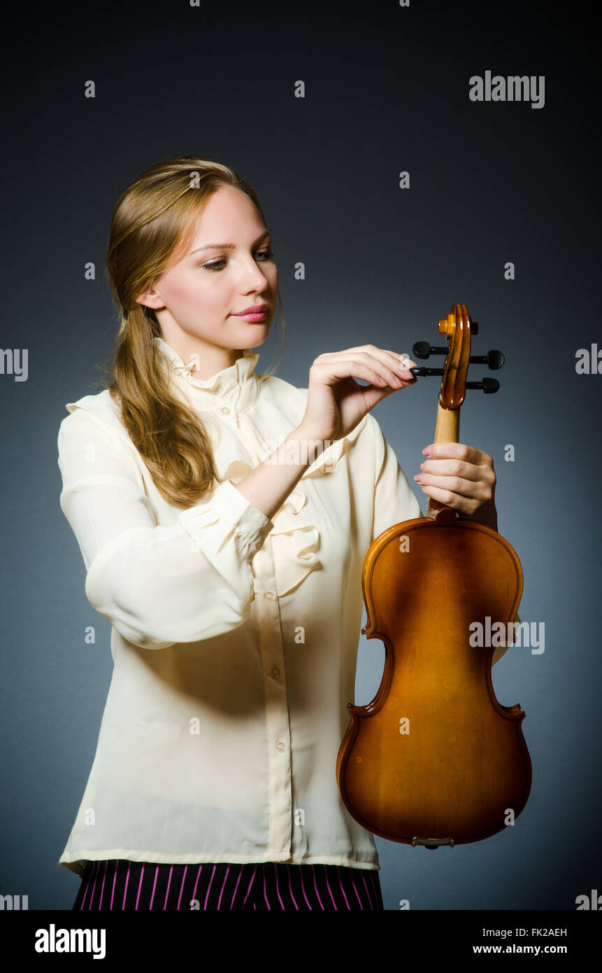 Woman violin player in musical concept Stock Photo - Alamy