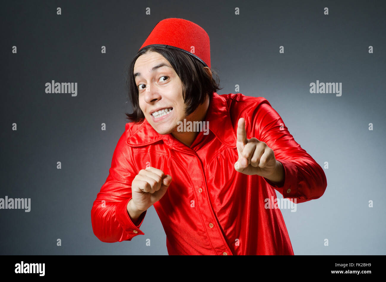 Man wearing red fez hat Stock Photo - Alamy