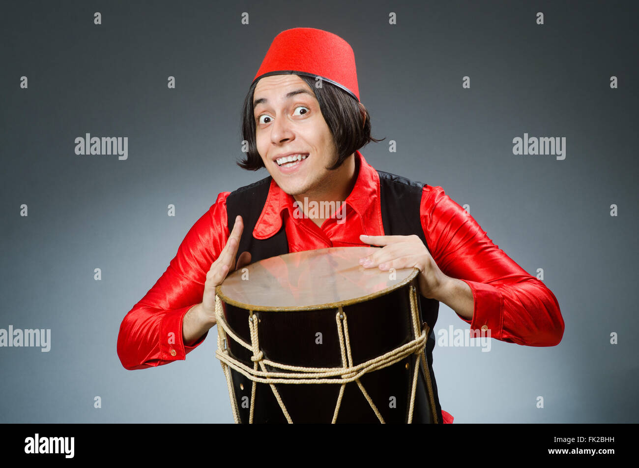 Man wearing red fez hat Stock Photo - Alamy