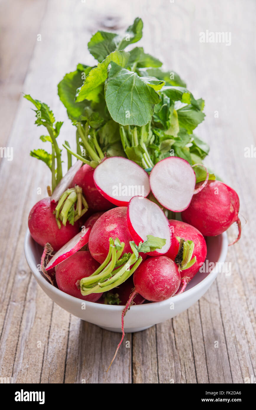 Garden red radish on wooden table hi-res stock photography and images ...