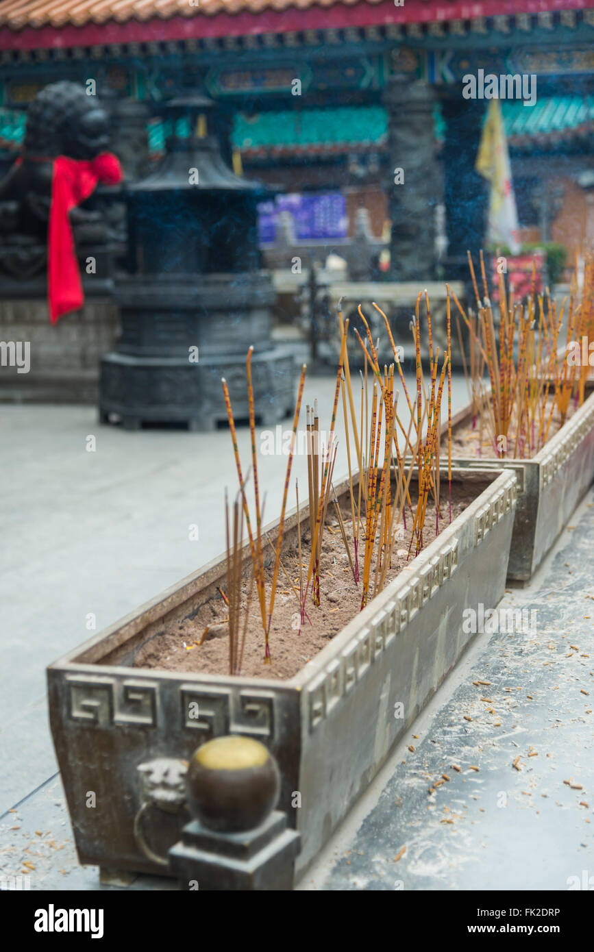Burning joss stick put in chinese pot of temple 2 Stock Photo - Alamy