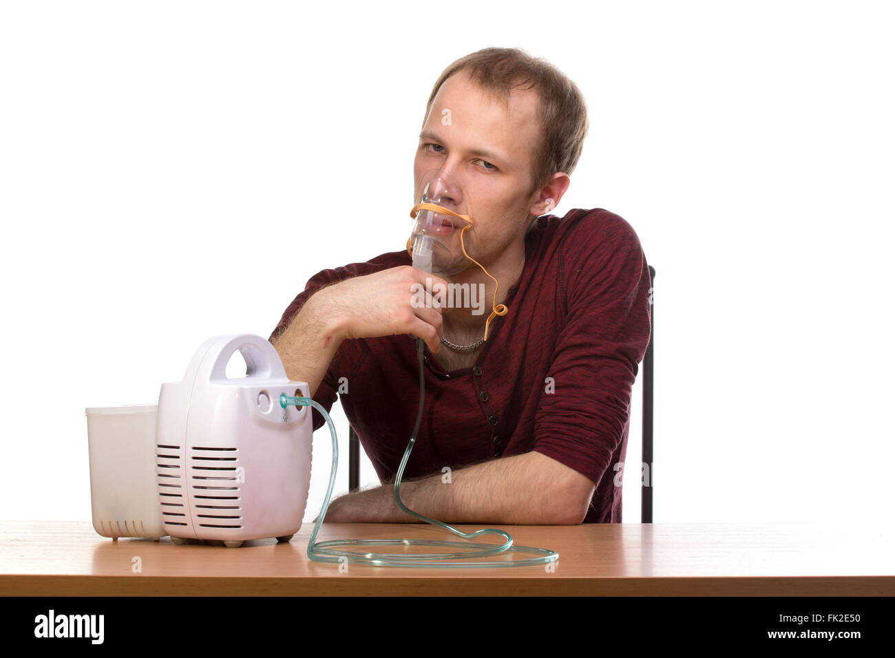 Young man using nebulizer mask for respiratory inhaler Asthma Treatment ...
