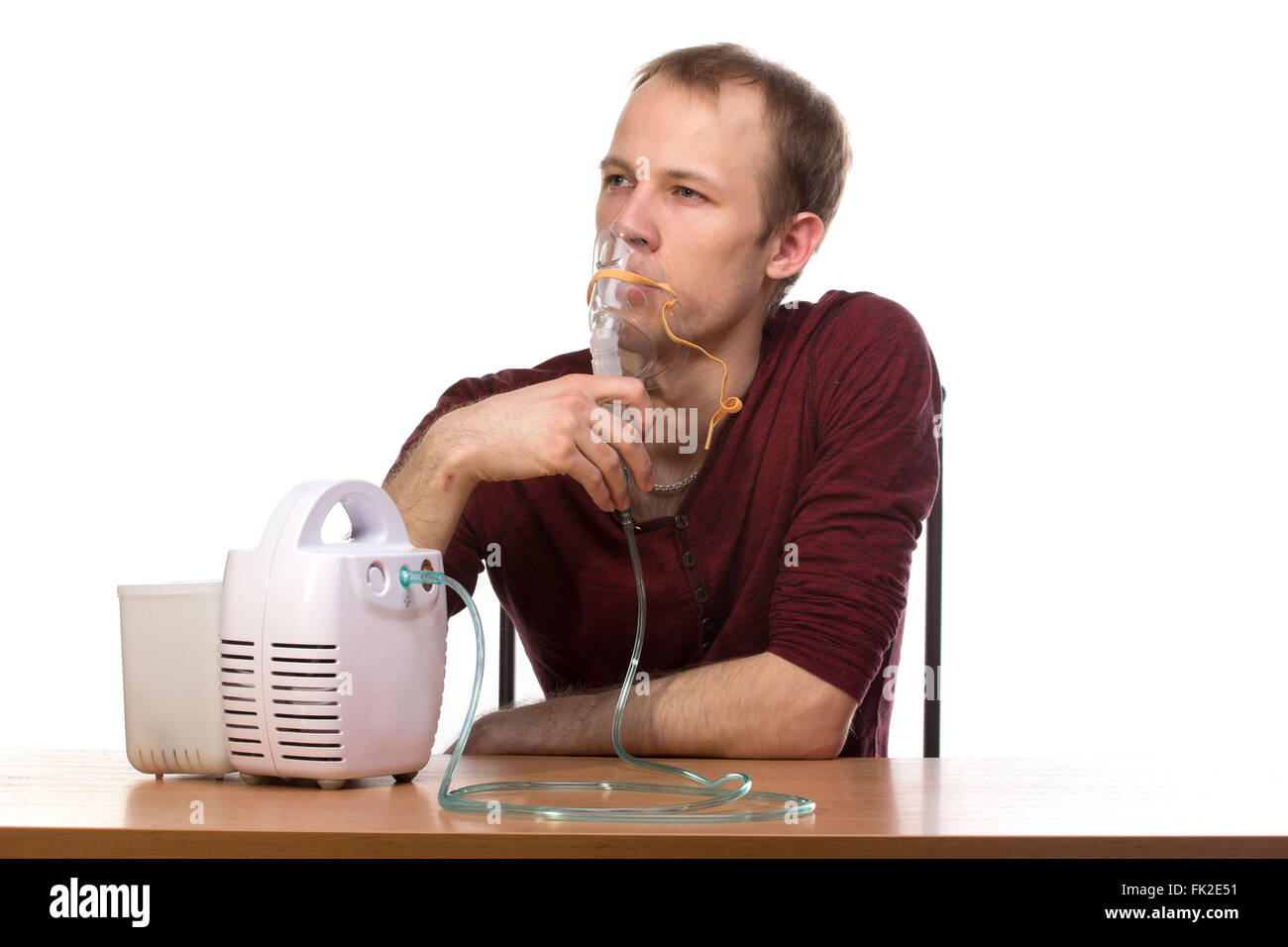 Young man using nebulizer mask for respiratory inhaler Asthma Treatment ...
