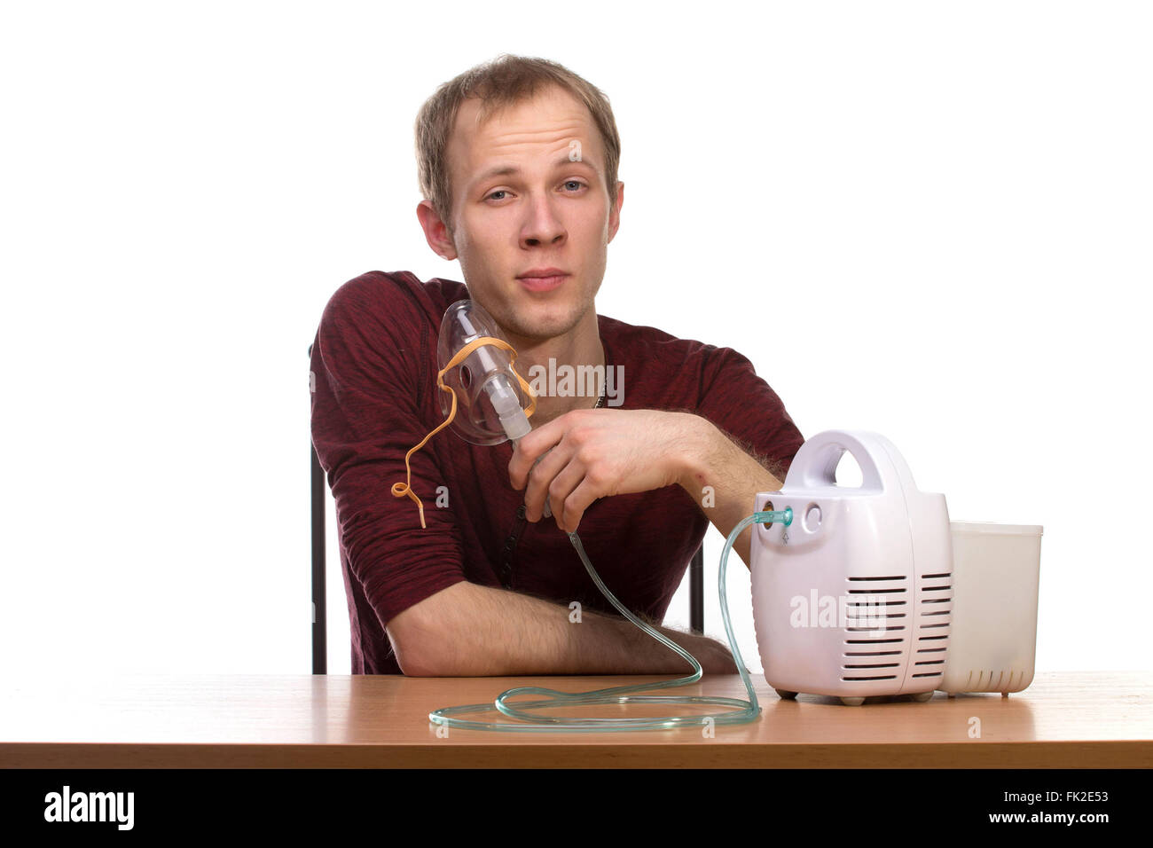 Young man using nebulizer mask for respiratory inhaler Asthma Treatment ...