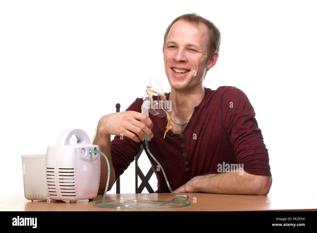 Young man using nebulizer mask for respiratory inhaler Asthma Treatment ...