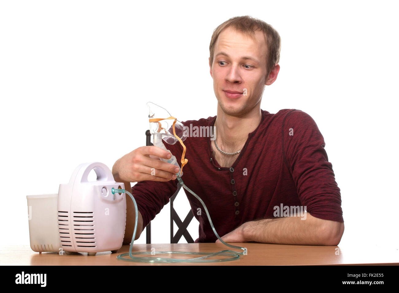 Young man using nebulizer mask for respiratory inhaler Asthma Treatment ...