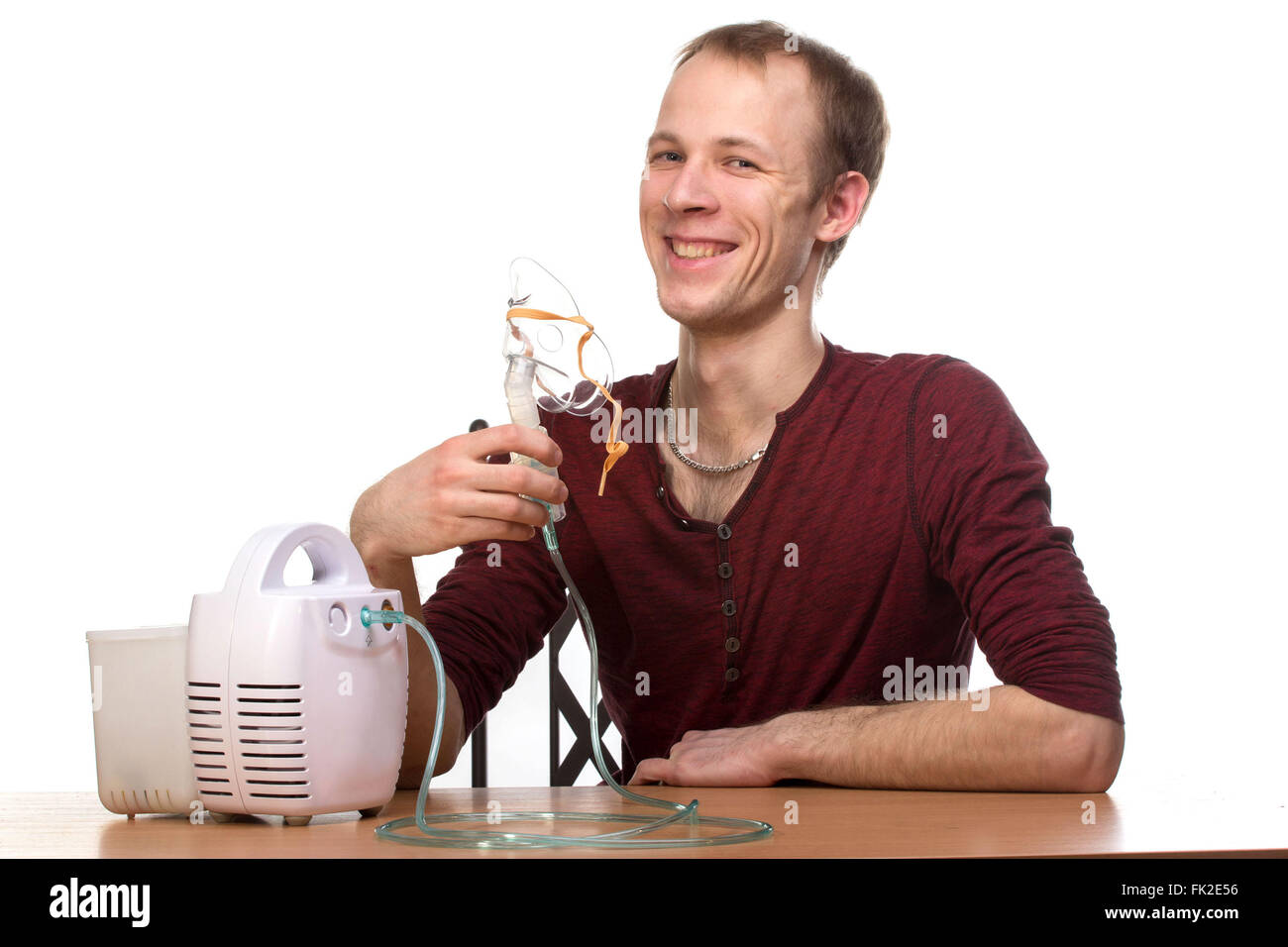 Young man using nebulizer mask for respiratory inhaler Asthma Treatment ...