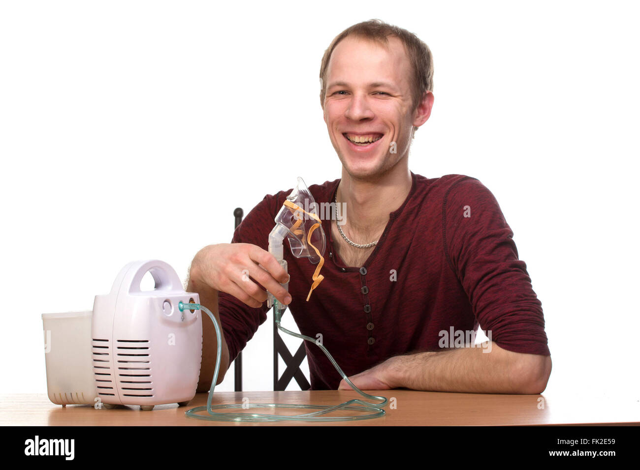 Young man using nebulizer mask for respiratory inhaler Asthma Treatment ...