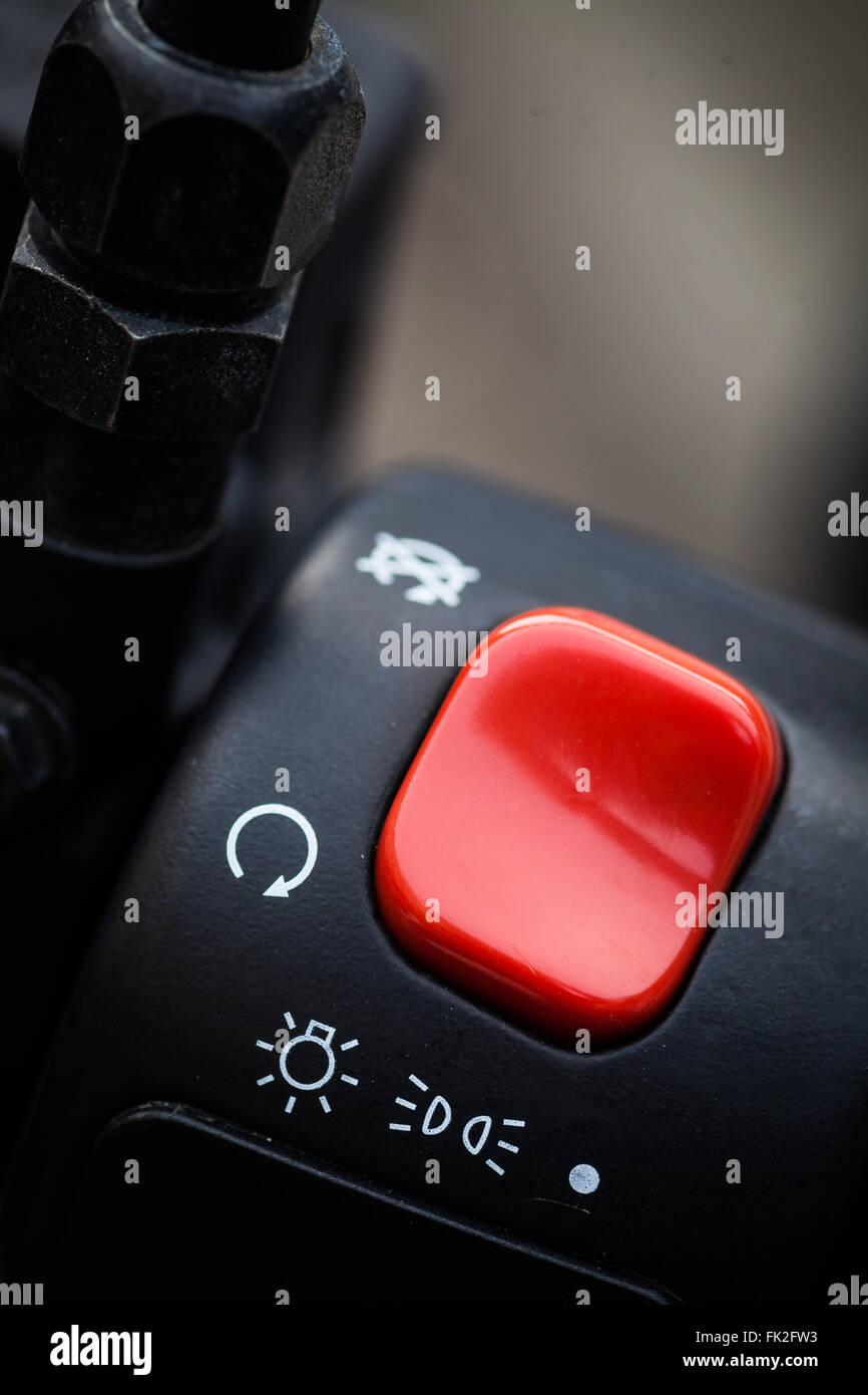 Color image of the ignition button of a motorcycle Stock Photo - Alamy