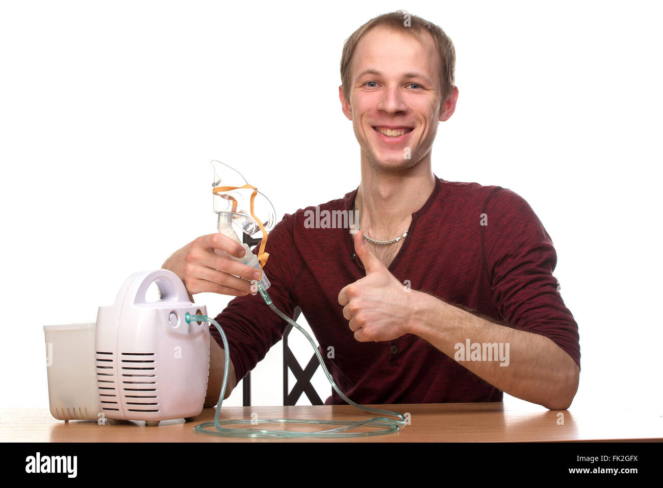 Young man using nebulizer mask for respiratory inhaler Asthma Treatment ...