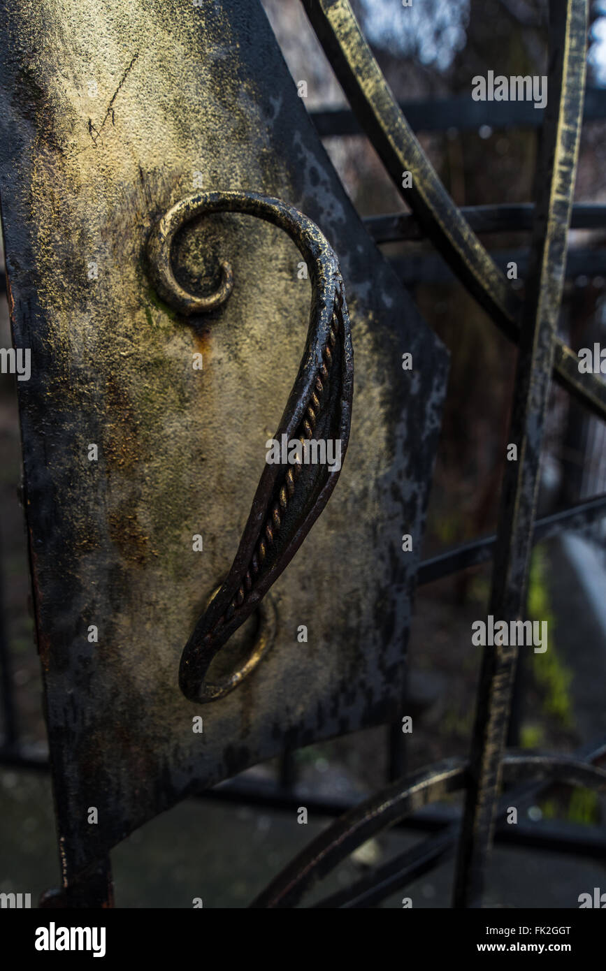 Forged iron door floral petals element close up Stock Photo - Alamy